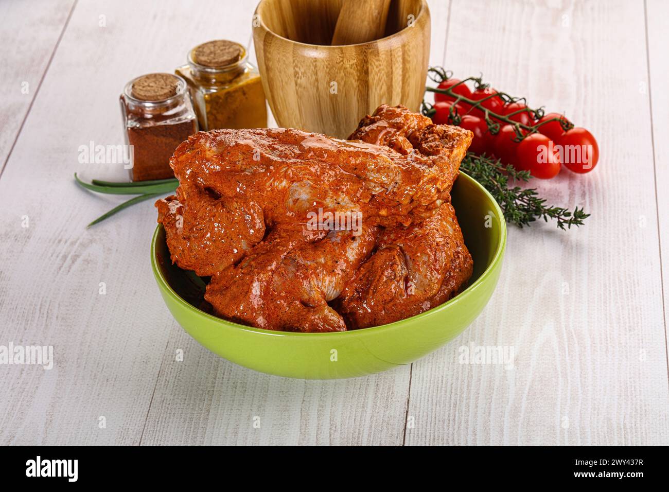 Raw turkey shoulder wing in Indian tandoori marinade spices Stock Photo ...