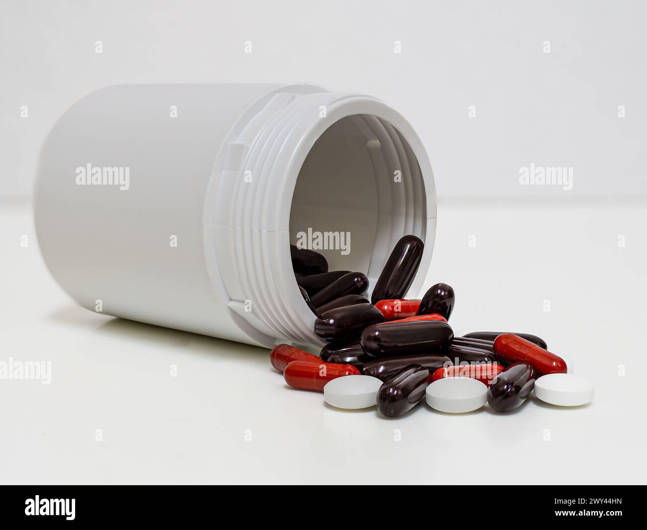 multi color capsule with white bottle Stock Photo - Alamy