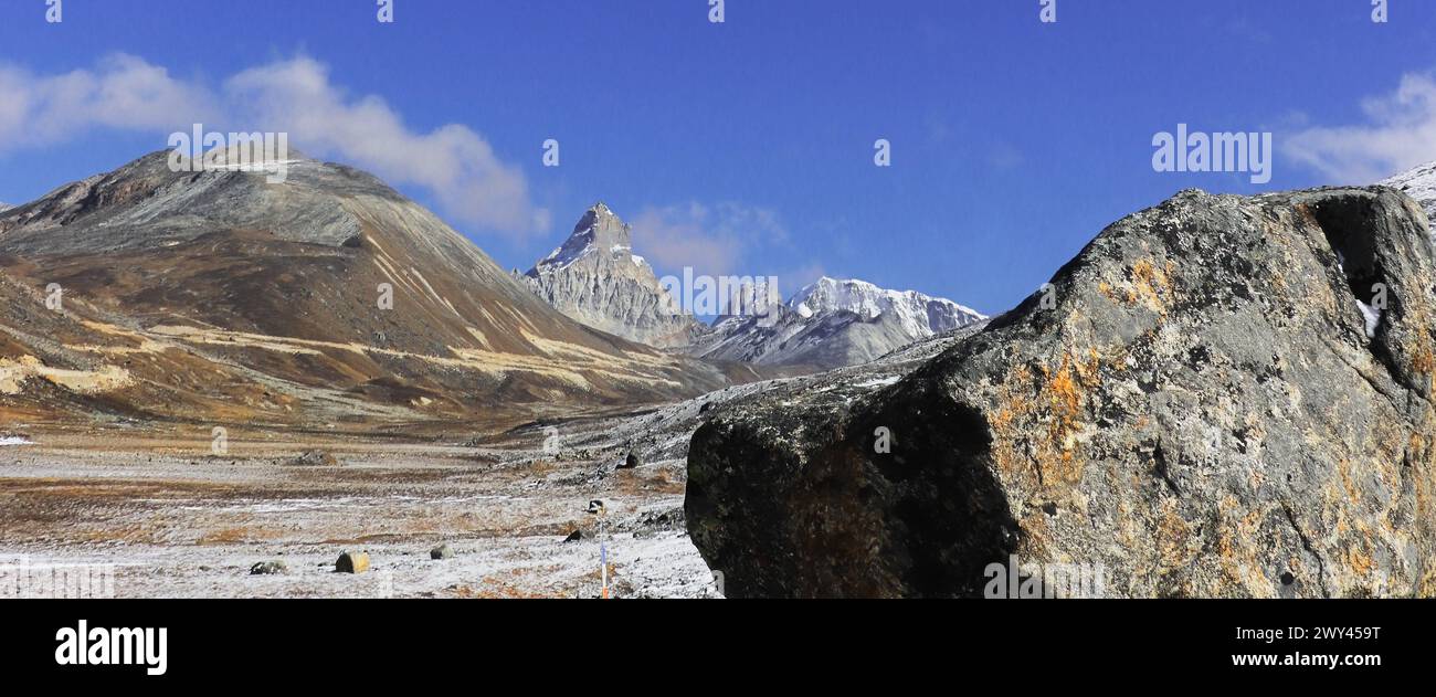 scenic alpine valley and surrounding snowcapped himalaya mountains at ...