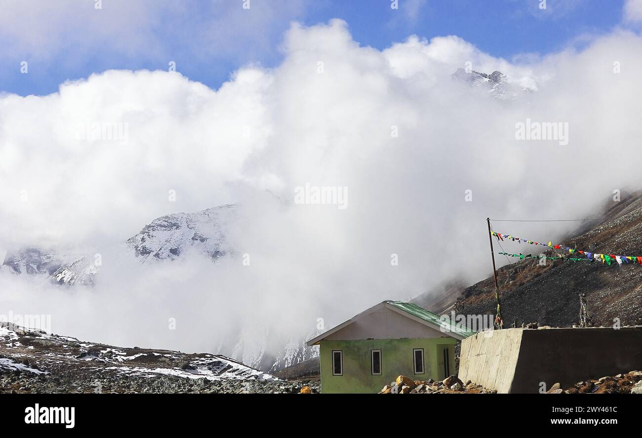 scenic alpine valley and surrounding snowcapped himalaya mountains at ...