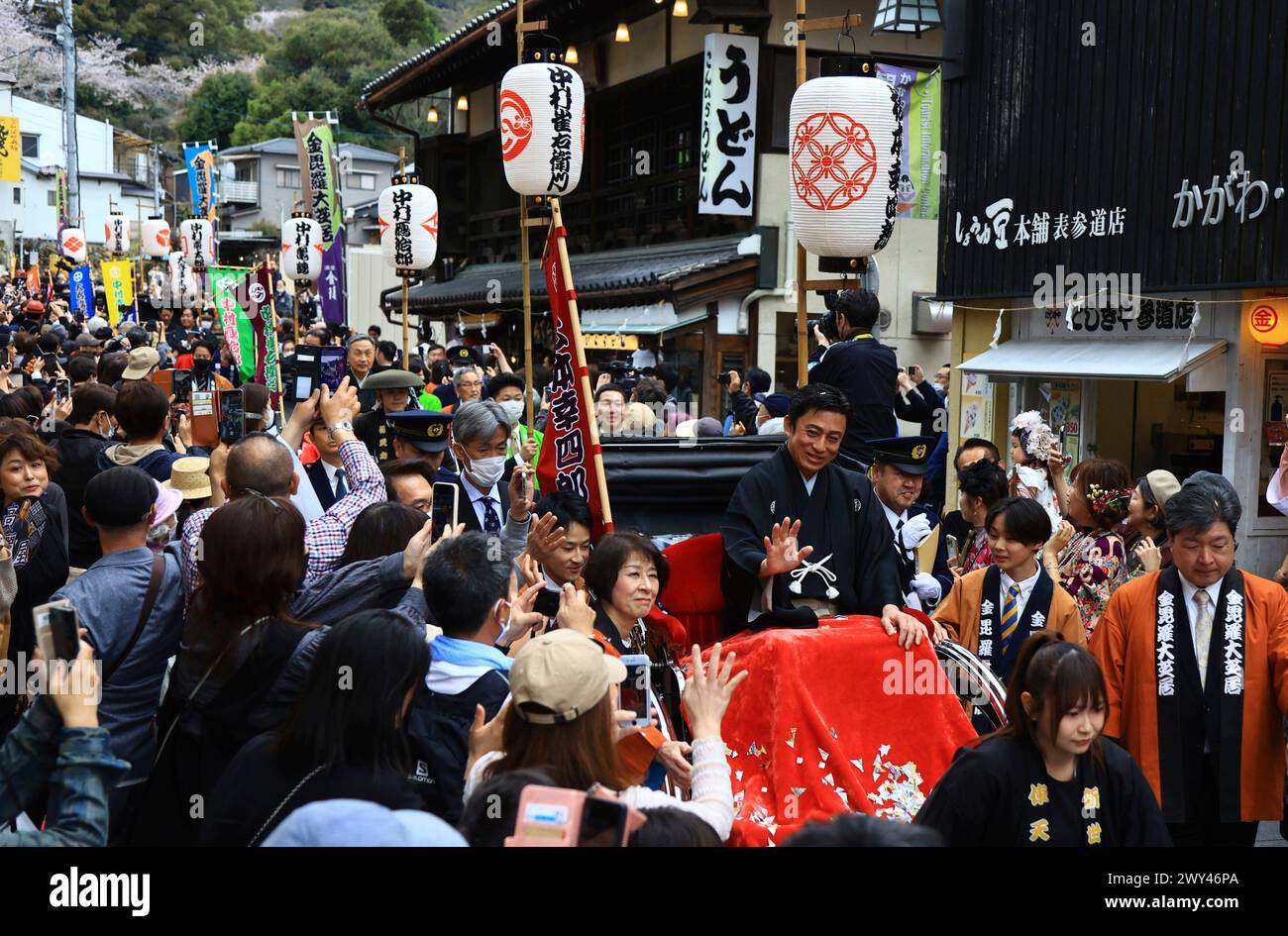 Kabuki actor Koshiro Matsumoto on a rickshaw waves his hand during ...