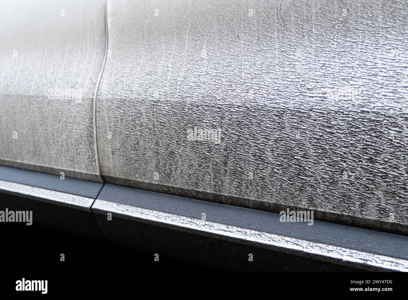 Side view of a very dirty car. Fragment of a dirty car. Dirty ...