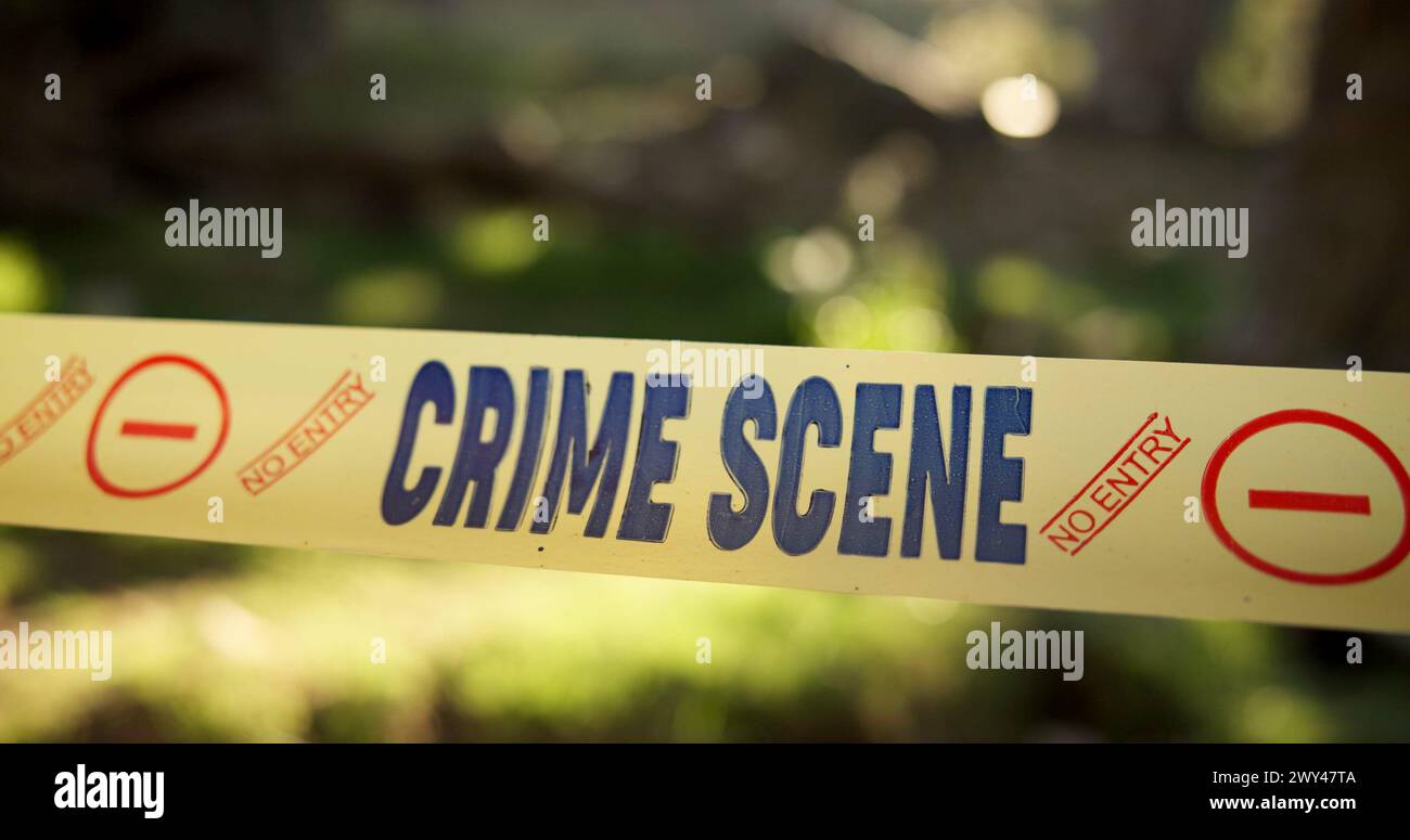Police, yellow line and crime scene in outdoor for murder, homicide and ...