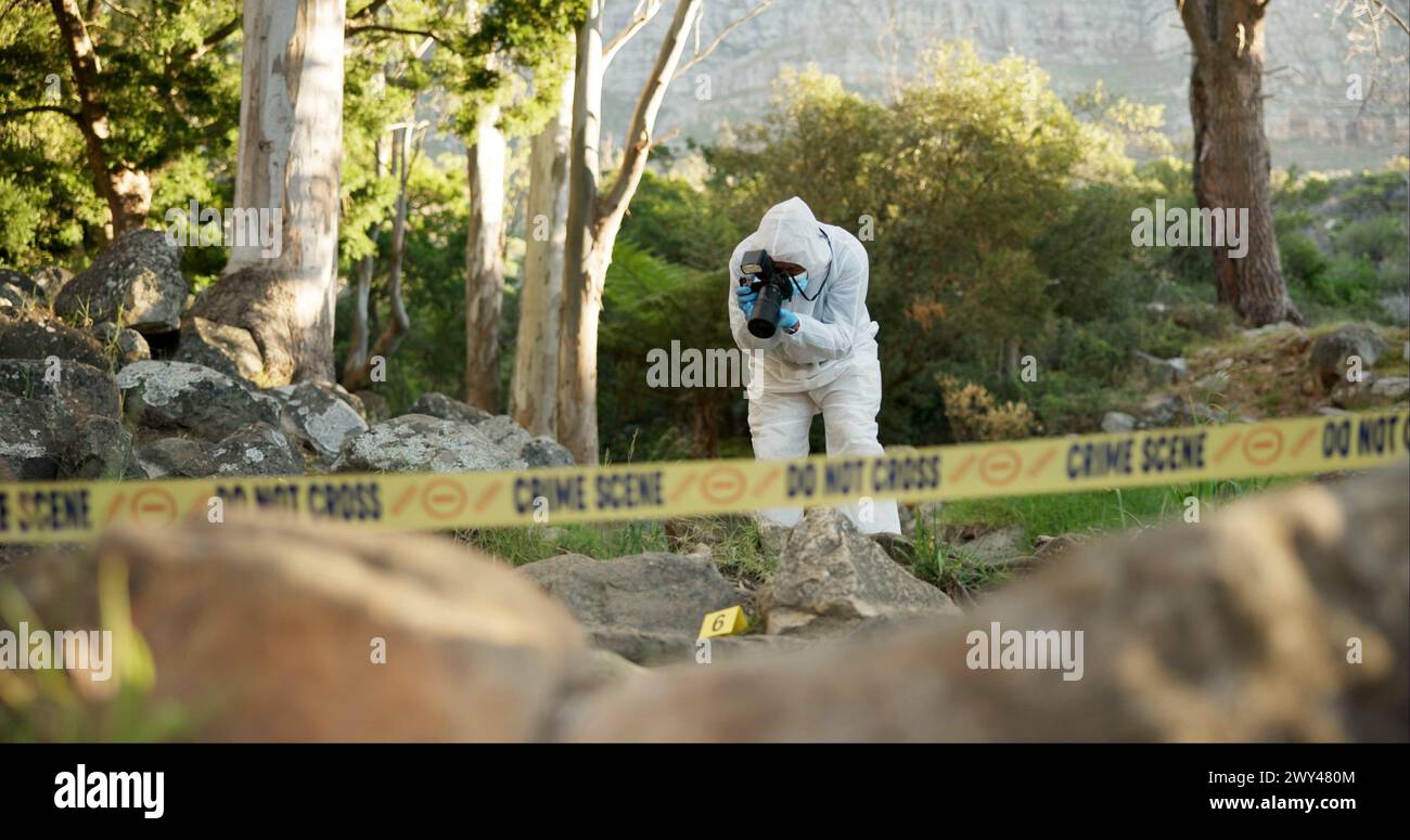 Forensic, photographer and evidence at crime scene for investigation in ...