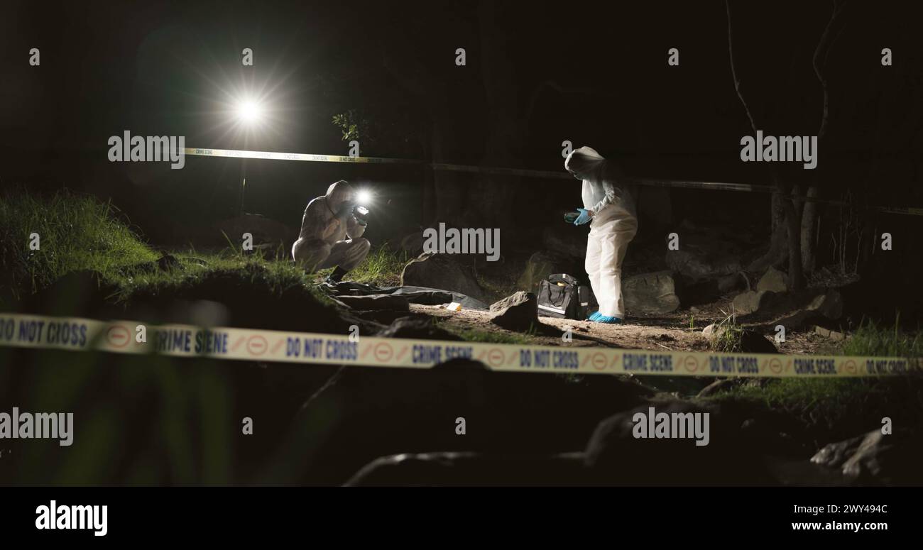 Forensic team, photographer and crime scene at night for investigation ...