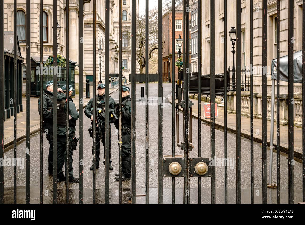 Armed police behind the gates of Downing Street. Number 10 Downing ...