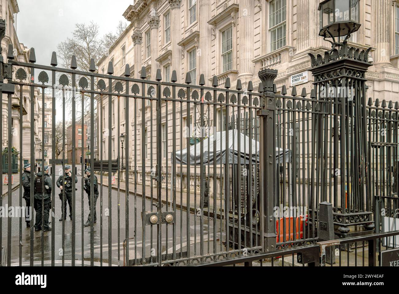 Armed police behind the gates of Downing Street. Number 10 Downing ...