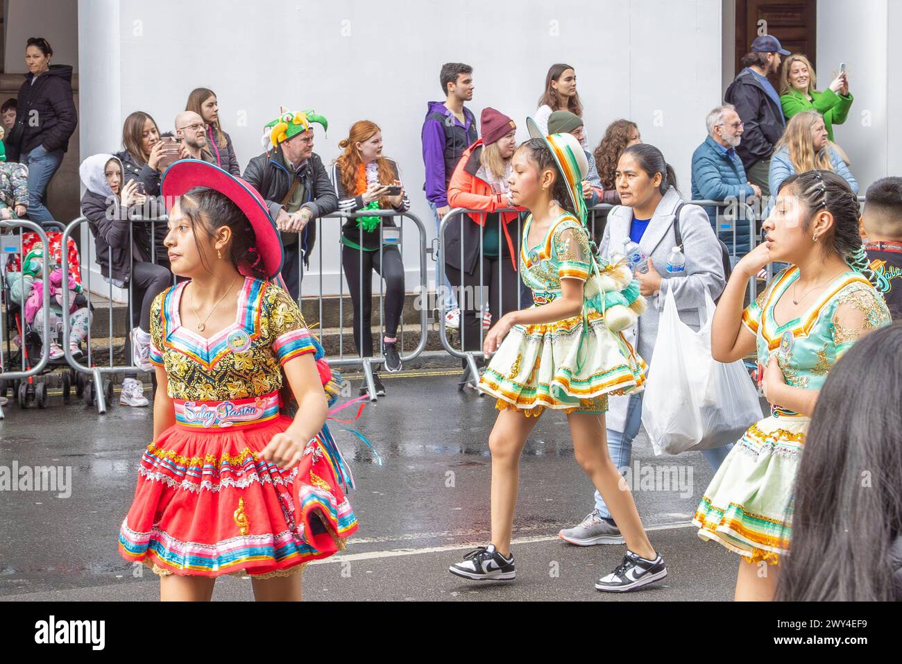 Bolivian dancers in brightly coloured costumes taking part in the ...