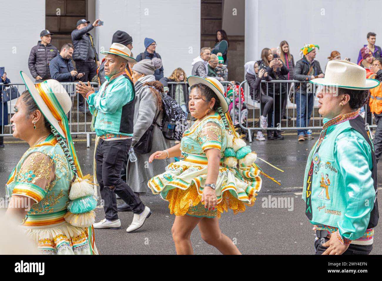 Bolivian dancers in brightly coloured costumes taking part in the ...