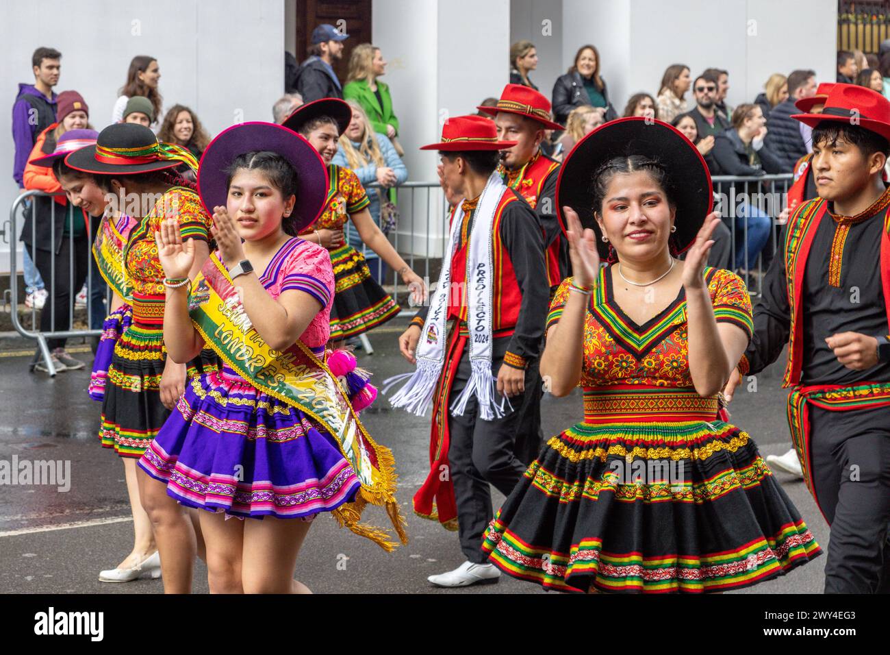 Bolivian dancers in brightly coloured costumes taking part in the ...