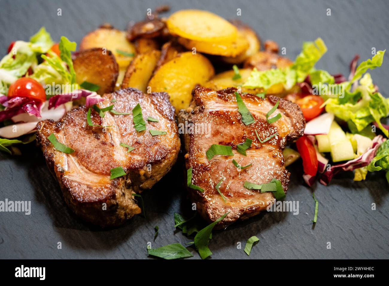 fried pork neck steak called noble roast Stock Photo - Alamy