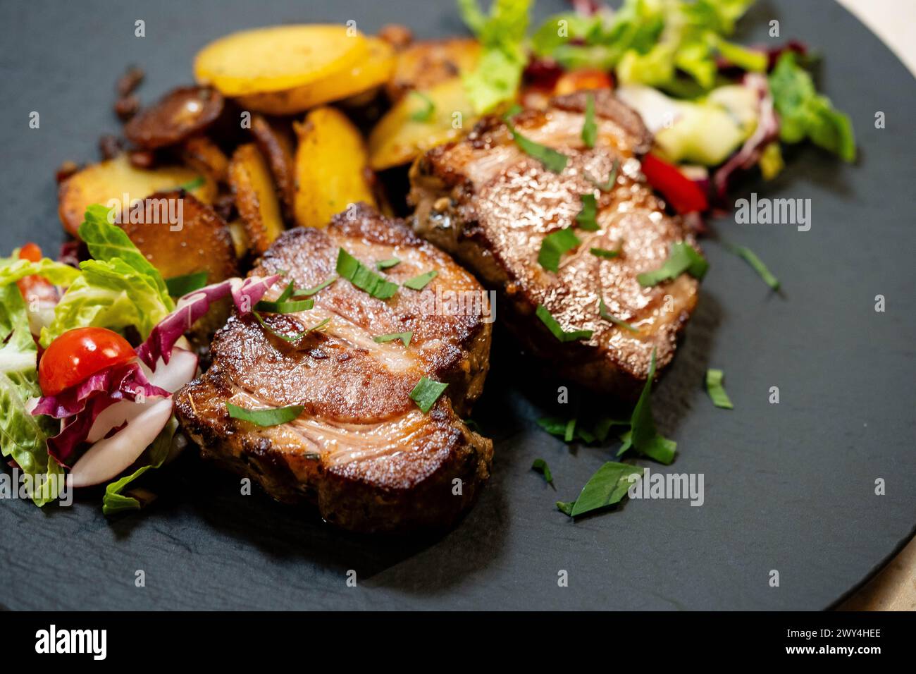 fried pork neck steak called noble roast Stock Photo - Alamy