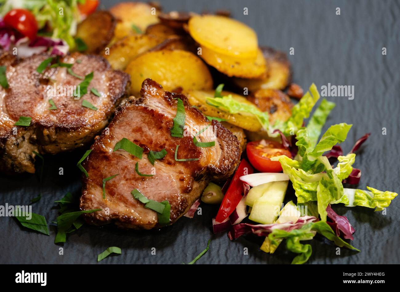 fried pork neck steak called noble roast Stock Photo - Alamy