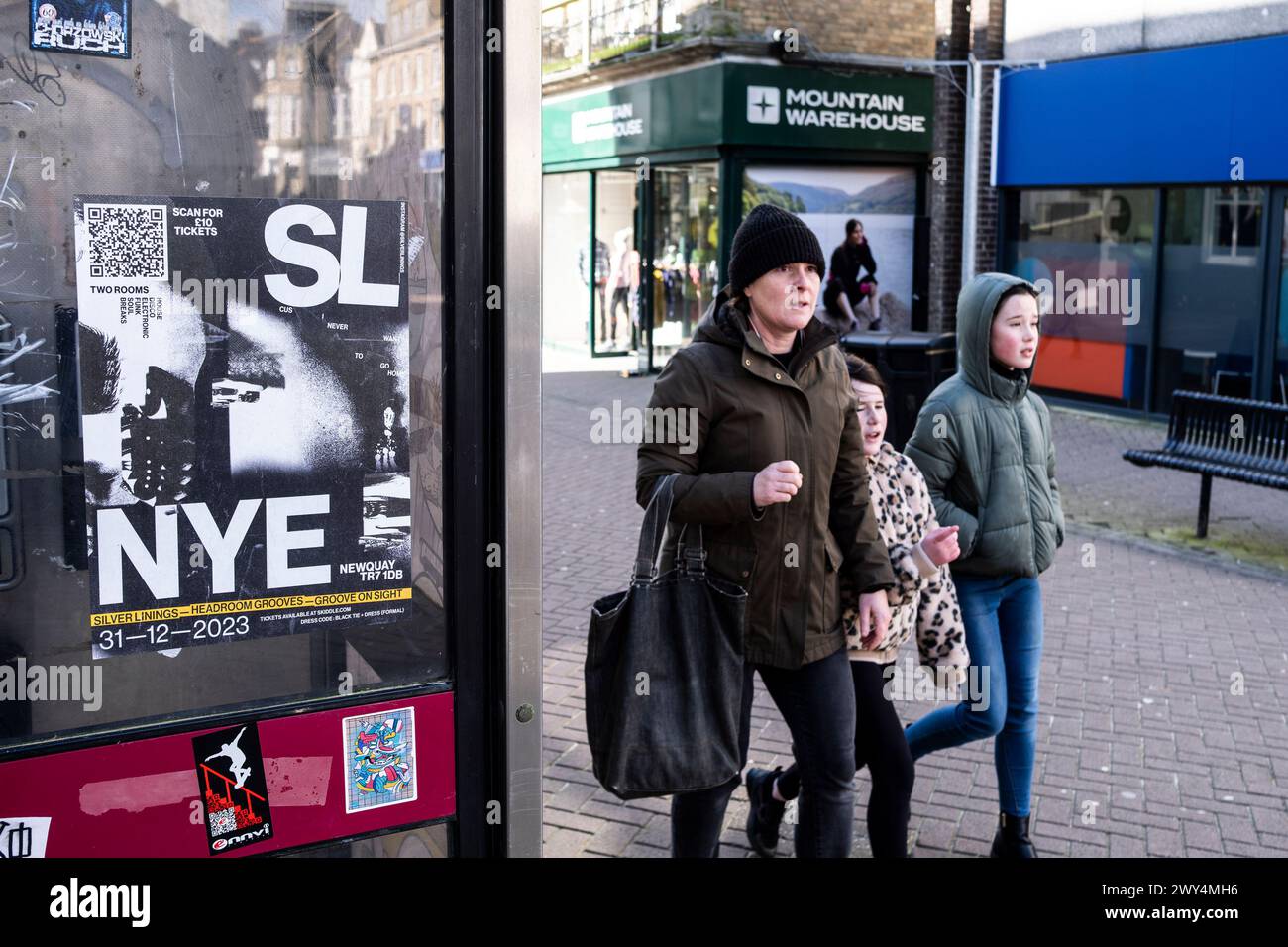 An ugly public telephone box covered in stickers in Newquay town centre ...