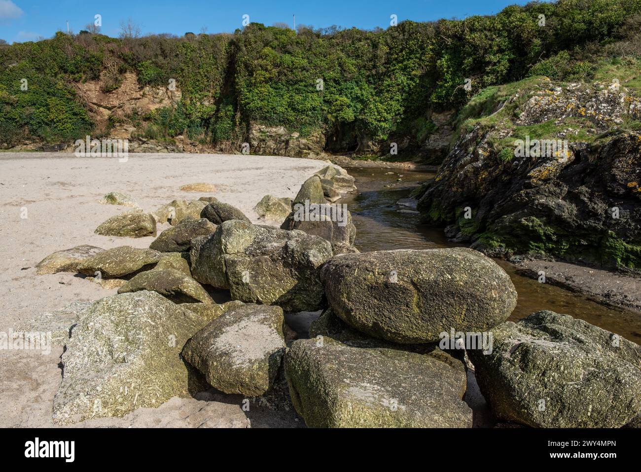 Boulders preventing erosion placed on the banks of the the Par Polmear ...