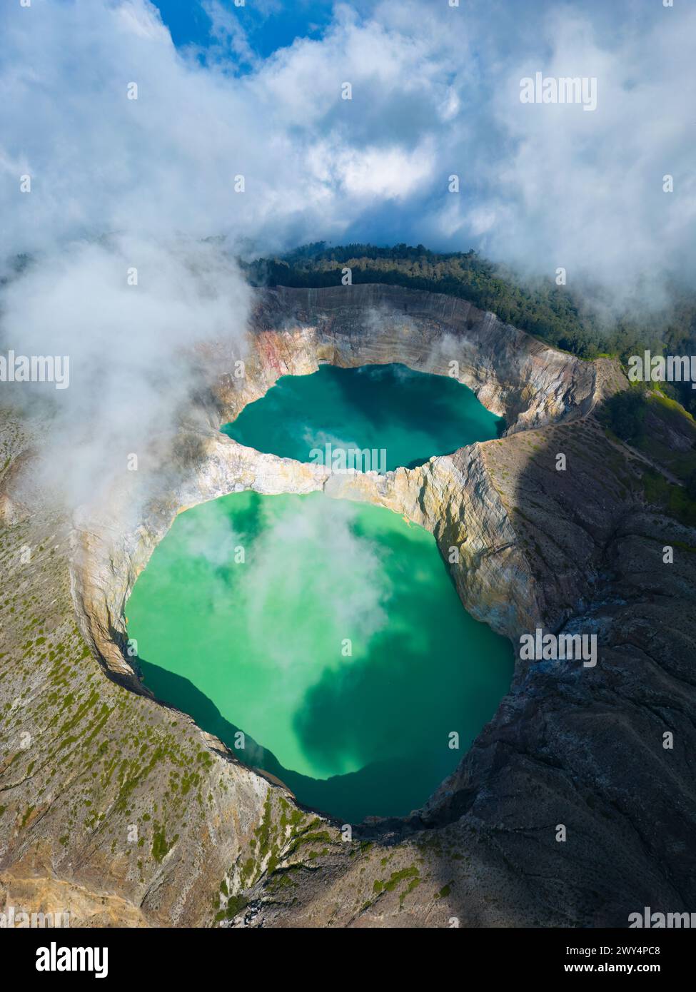 An aerial view of Kelimutu National Park's crater lakes on Flores ...
