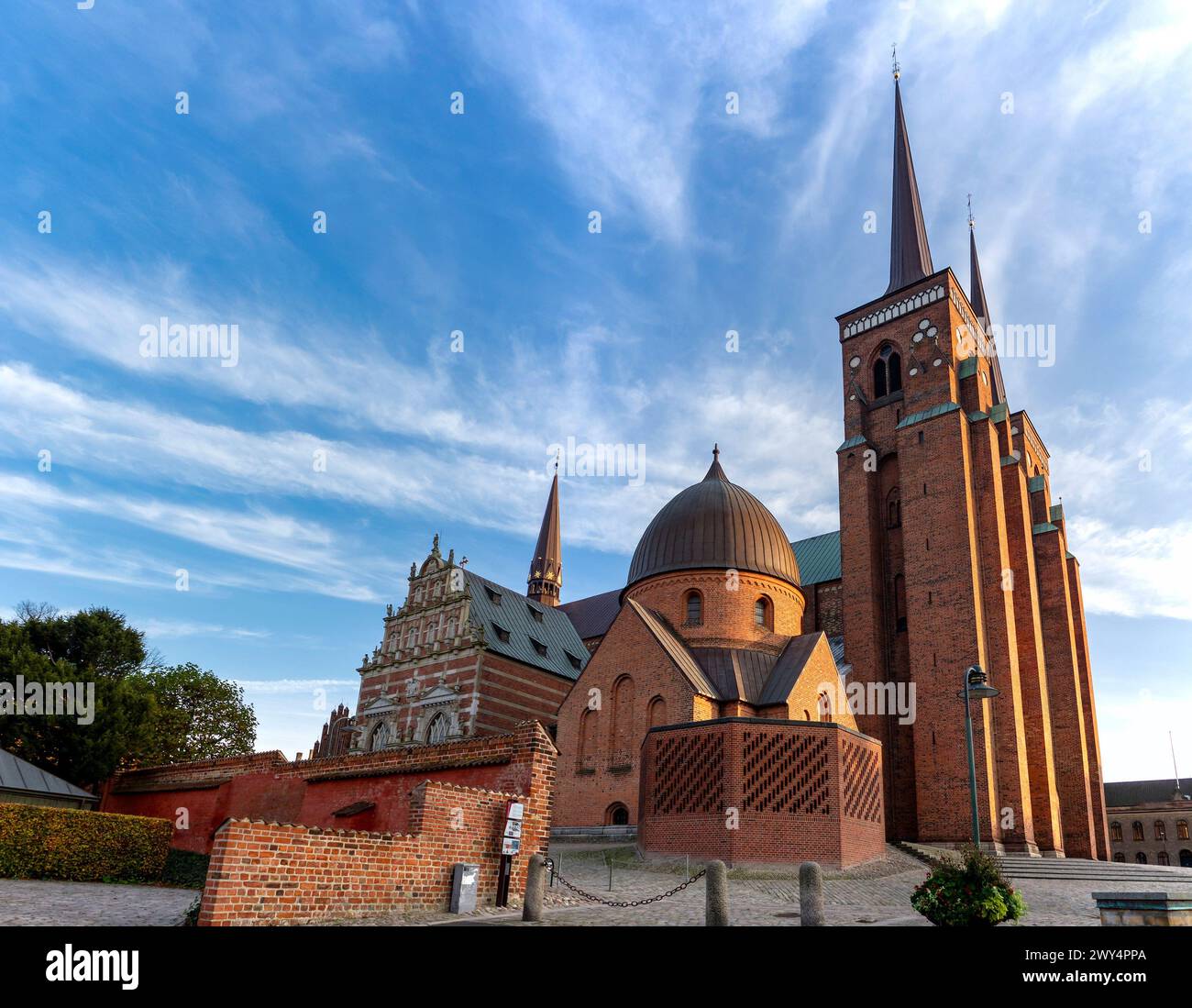 Wide angle image of Roskilde Cathedral in Denmark at sunset Stock Photo ...