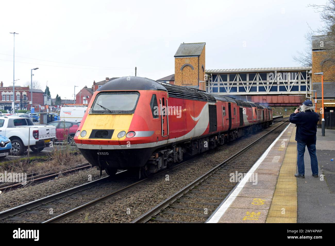 A rail enthusiast photographs ex EMR HST power cars leaving the Severn ...