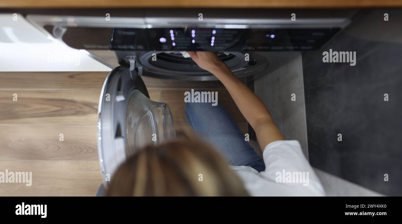 Woman take out laundry from hi-res stock photography and images - Alamy