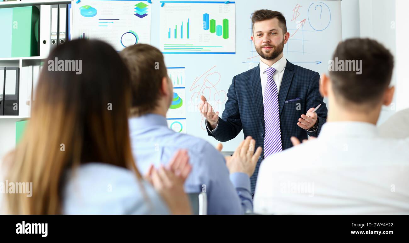 Bunch of people listening man in suit and tie telling something Stock ...