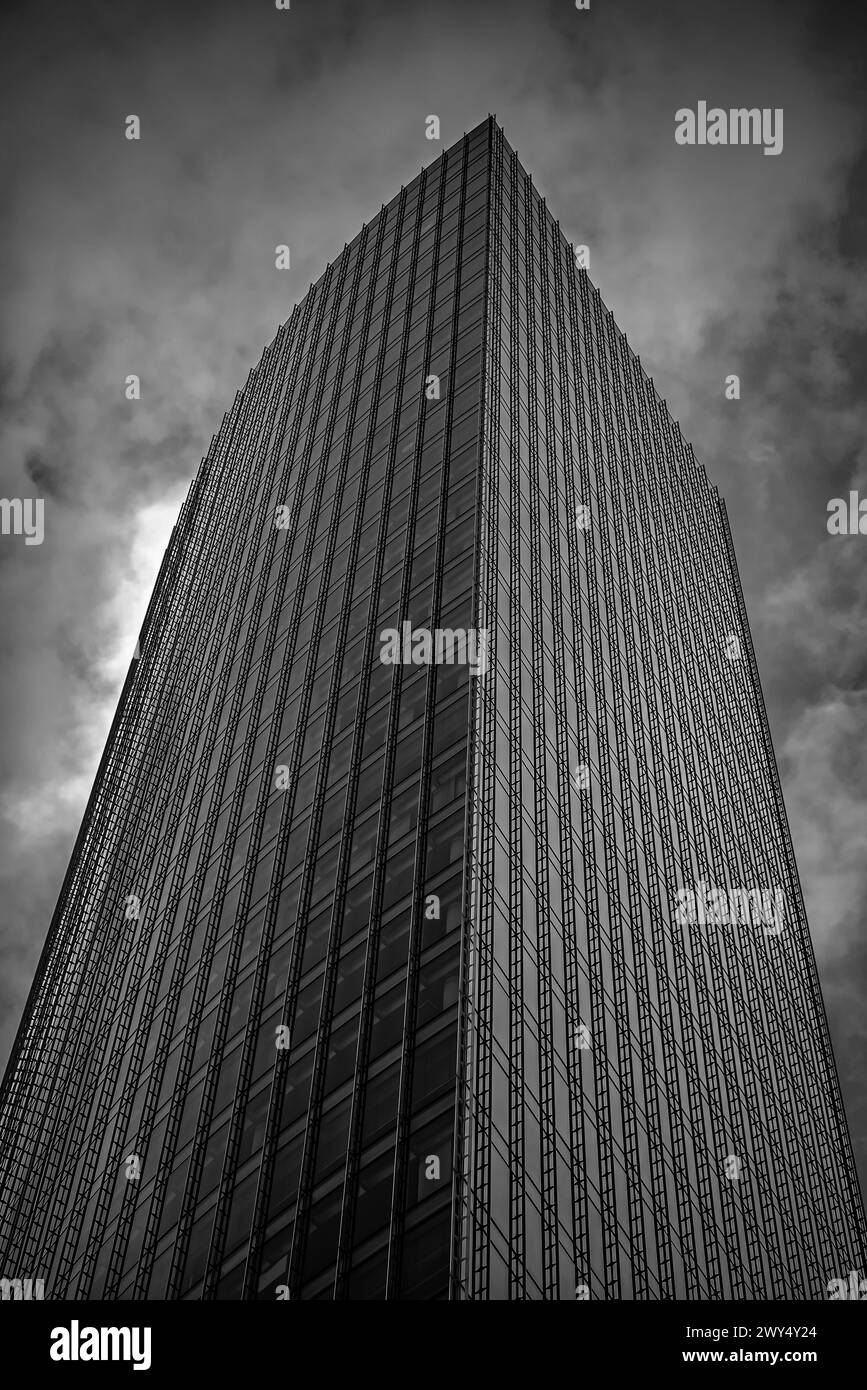 A modern skyscraper with a unique, cantilevered window design Stock ...