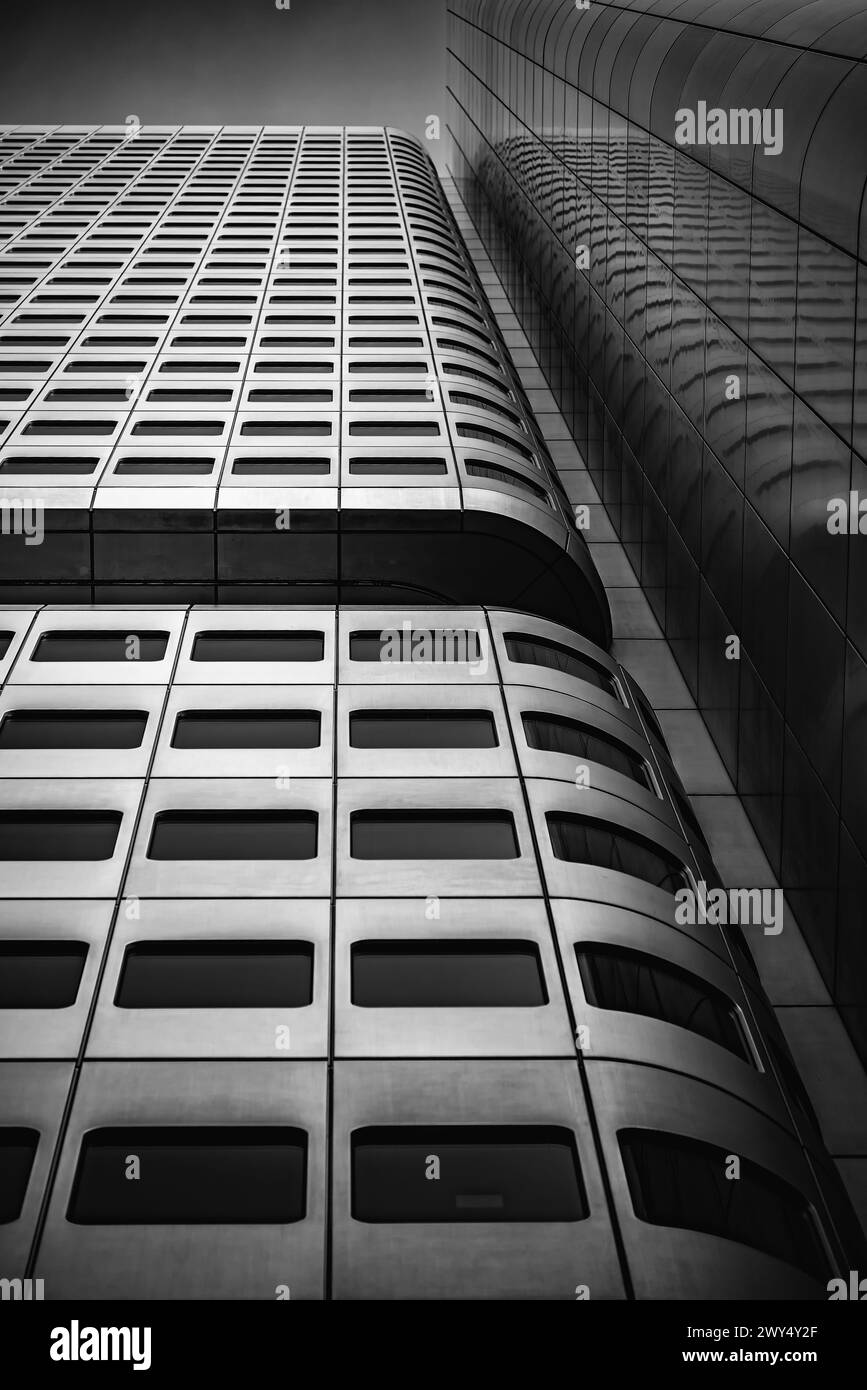 Two towering skyscrapers in focus with a third building in the ...