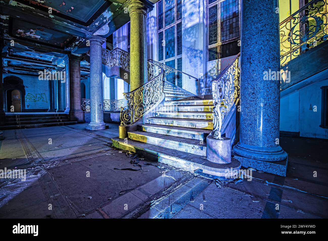 Spooky mansion entrance with eerie blue light shining through windows ...