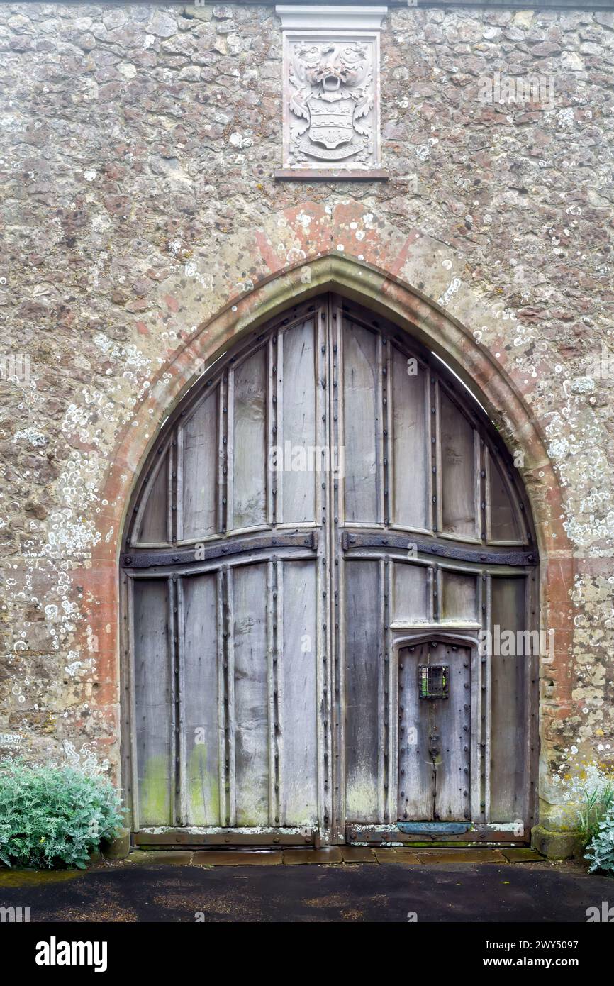 Beautiful old, big, vaulted wooden doors with a smaller door for people ...