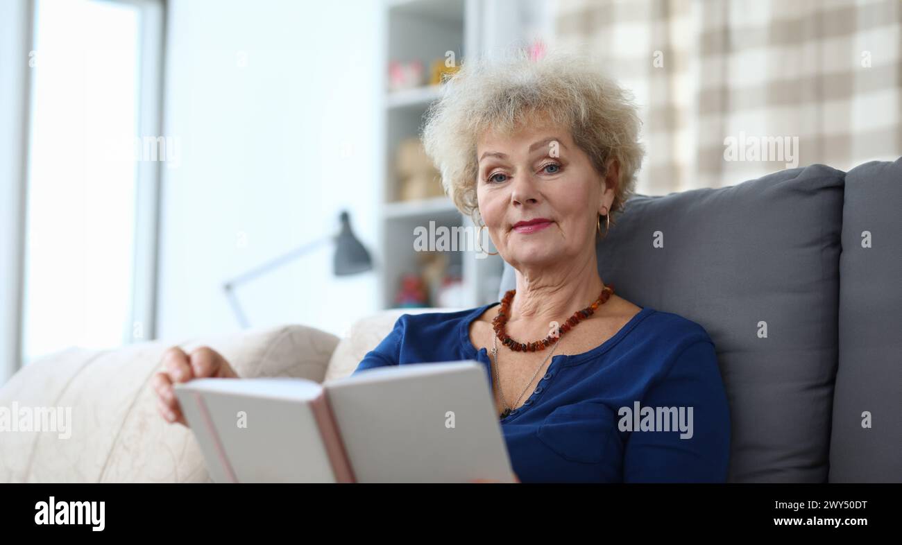 Elderly woman self-isolation reading book at home Stock Photo - Alamy