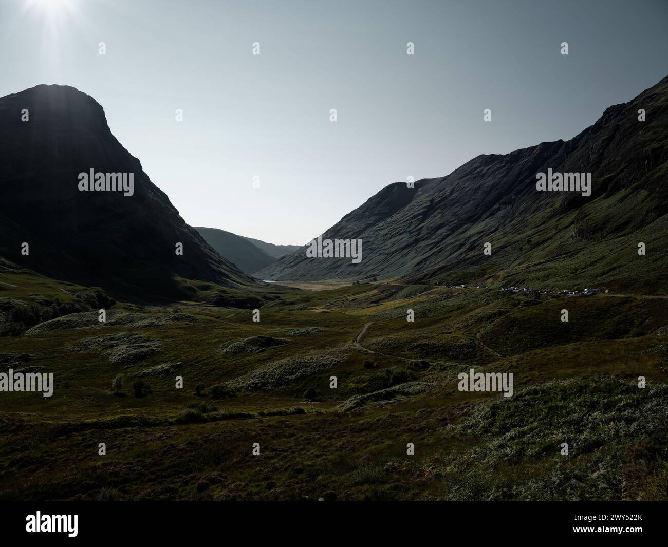 The dark backlit summer landscape of Glencoe Highlands Scotland UK ...