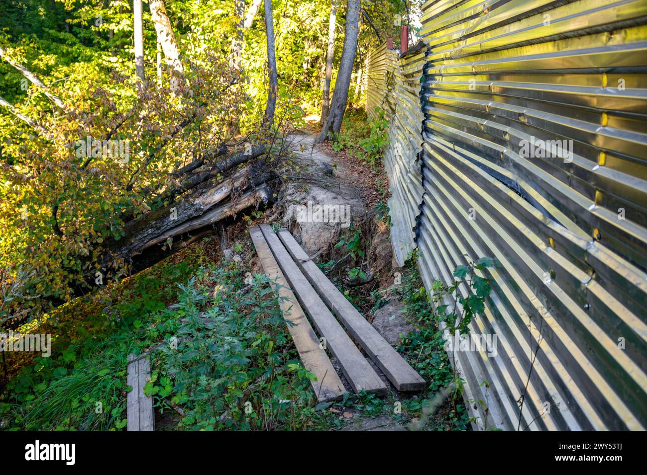 Dangerous transition on boards through a landslide on the edge of a ...