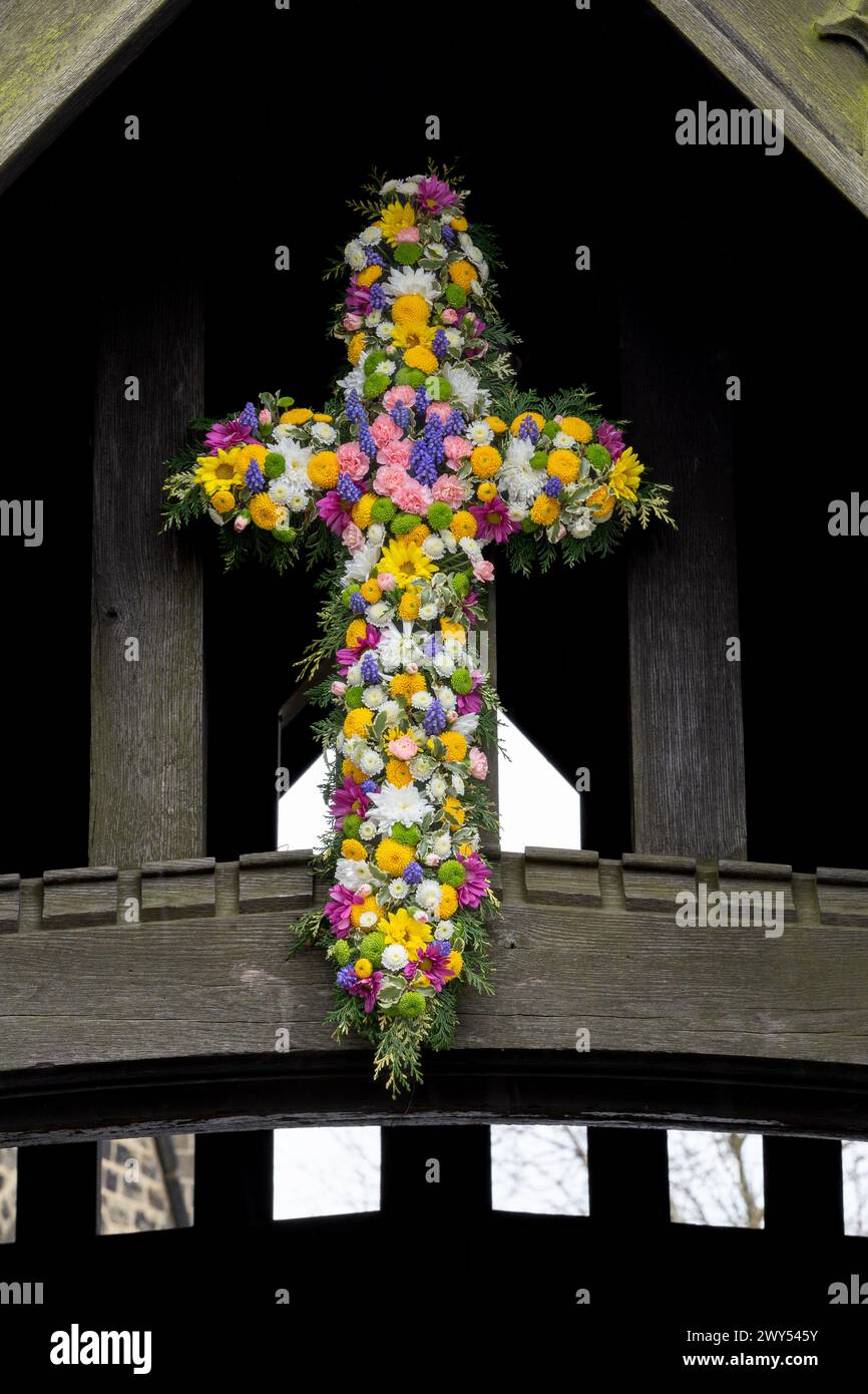 A floral Easter Cross above the lychgate at St John's Church of England ...