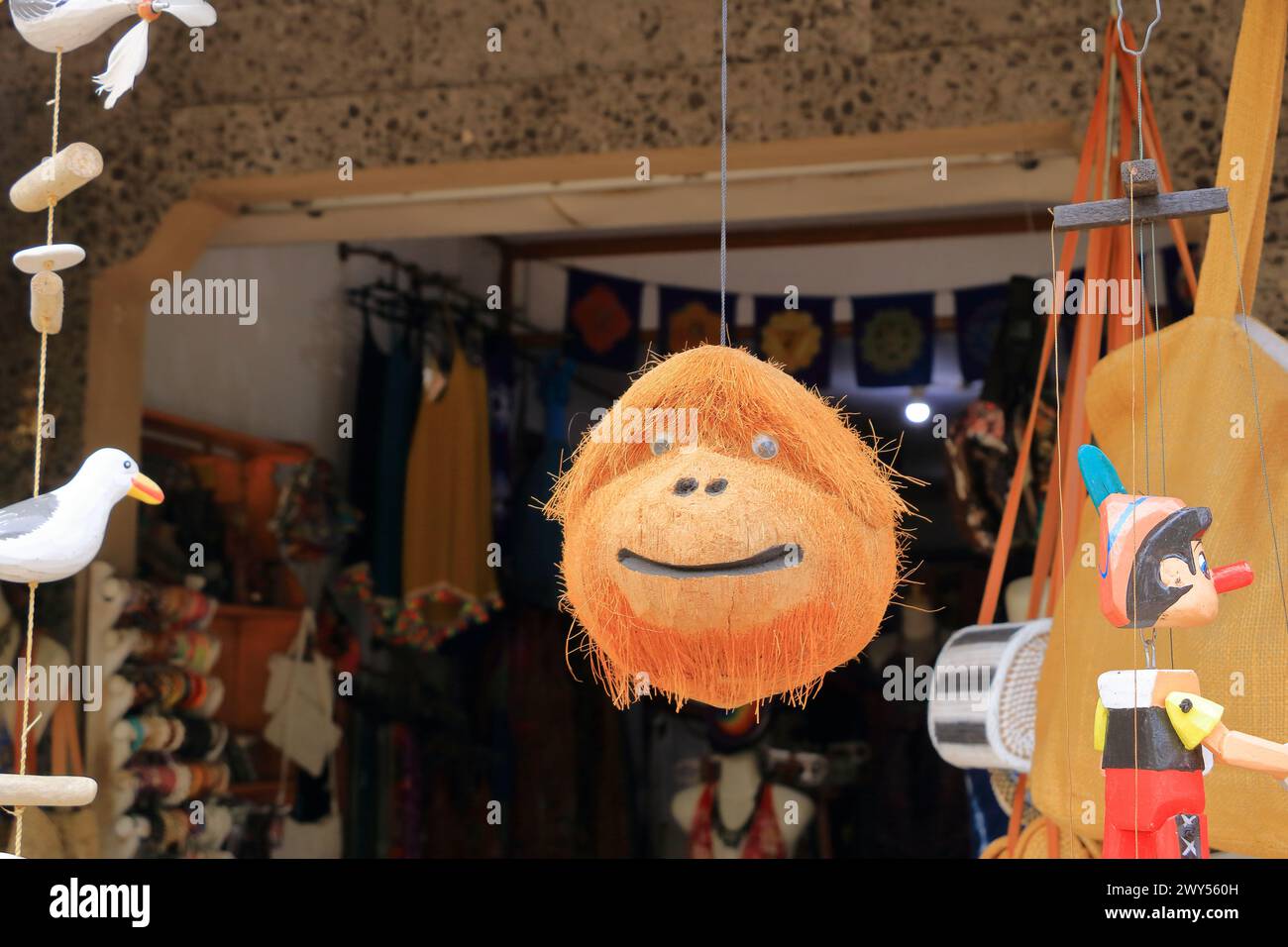 wooden monkey sculpture, made from a coconut Stock Photo - Alamy