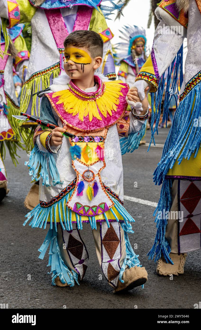 CHild in elaborate Native American costume marching in the Tenerife ...
