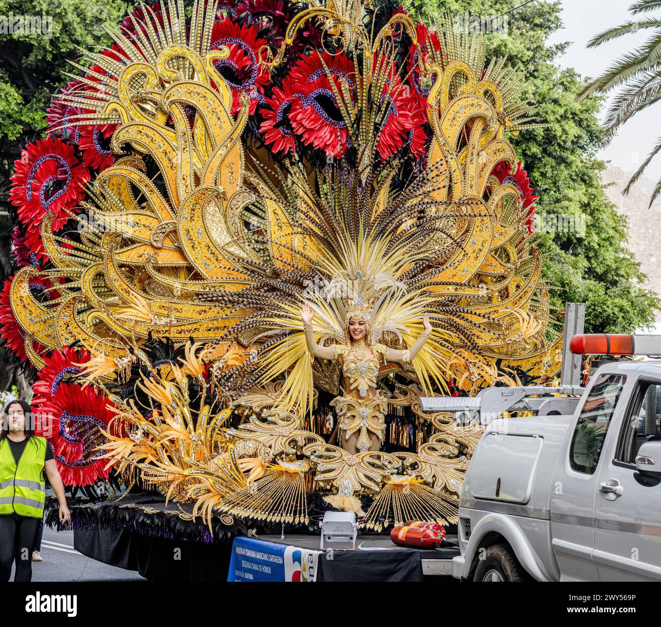 Woman in elaborate costume on enormous decorated float in tenerife ...