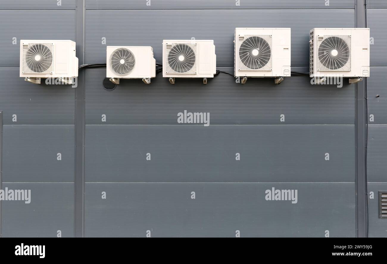Five air conditioners installed on the wall of the store Stock Photo ...
