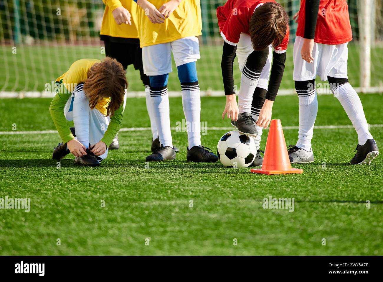 Diverse children playing football hi-res stock photography and images ...