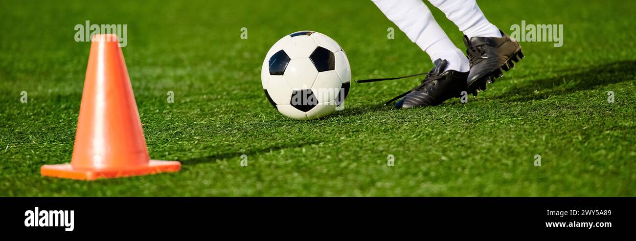 A person demonstrates their soccer skills by kicking a soccer ball ...