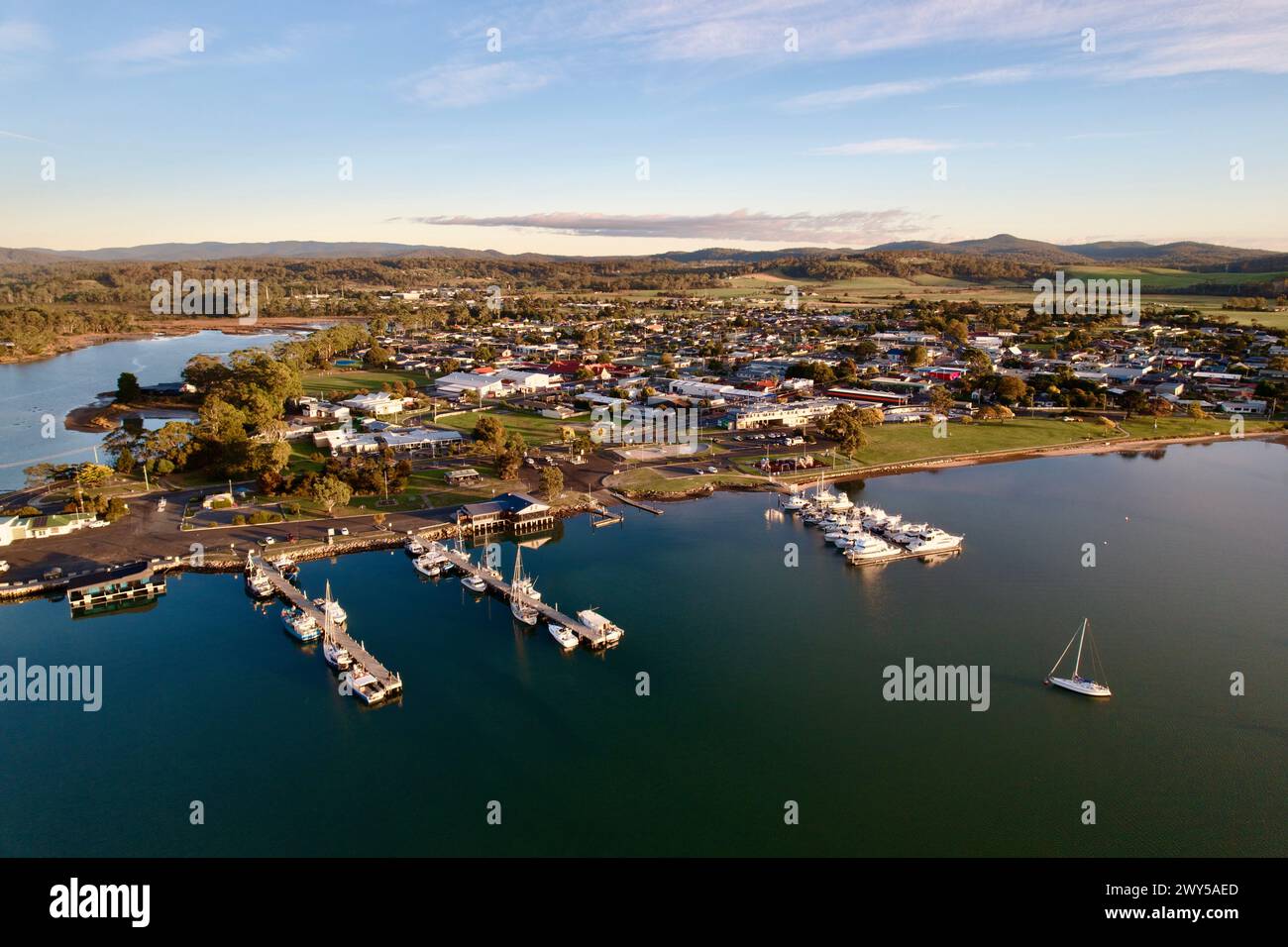 An aerial view of Saint Helens with moored boats along the shoreline ...