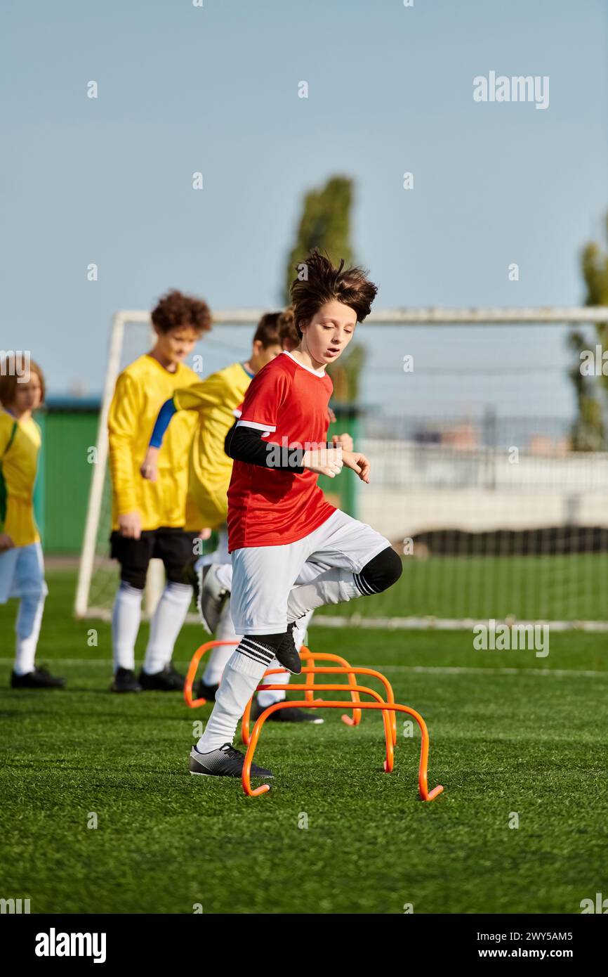 A dynamic group of young children engage in a spirited game of soccer ...