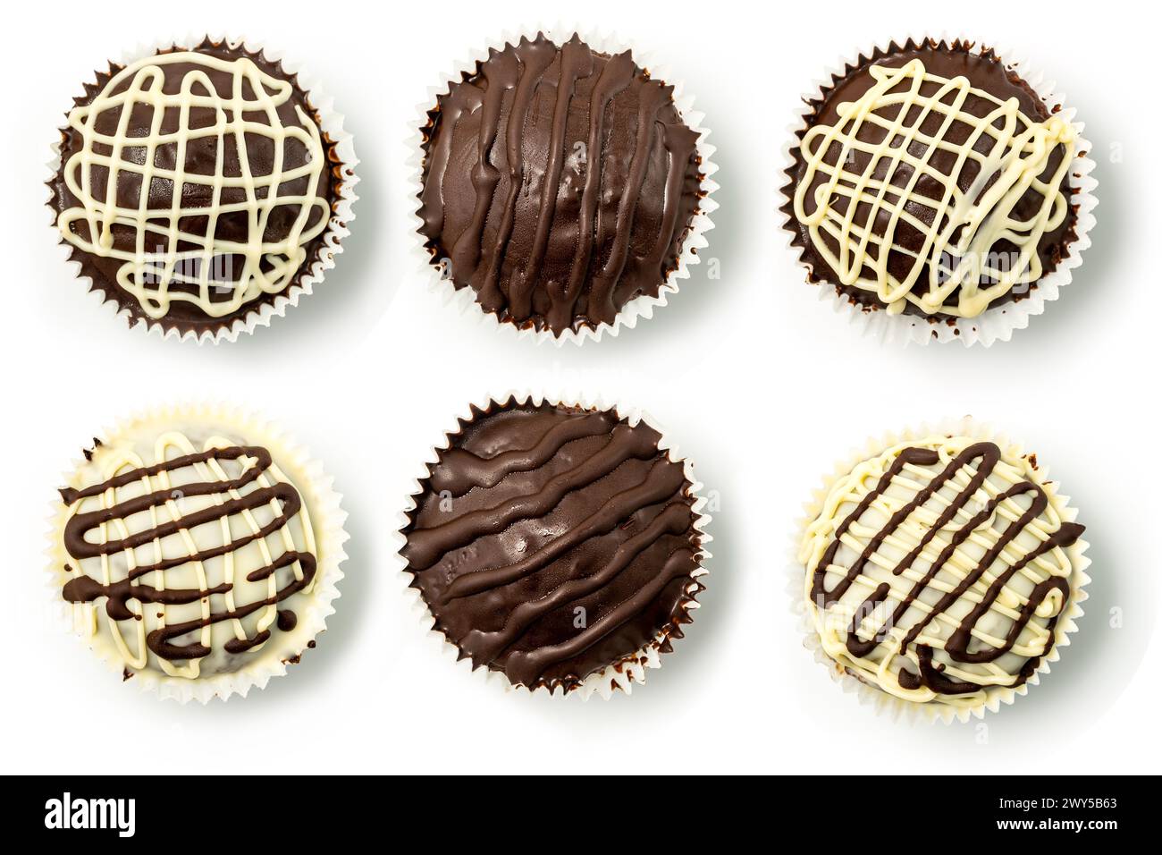 Six Chocolate muffins Isolated on white. Homemade dark and white ...