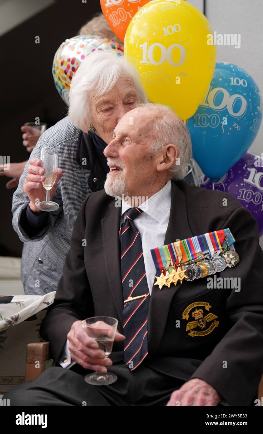 D-Day veteran John Roberts receives a kiss from his wife Gillian as he ...