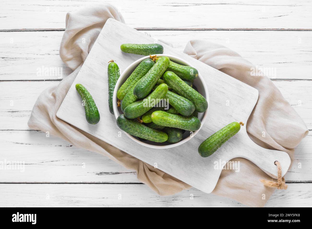 Fresh ripe organic small gherkin cucumbers in bowl or basket, not ...