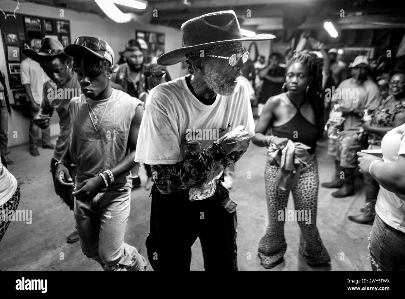 Shelby, North Carolina, USA. 17th Aug, 2023. A cowboy holds on to his jar of moon shine during a ...
