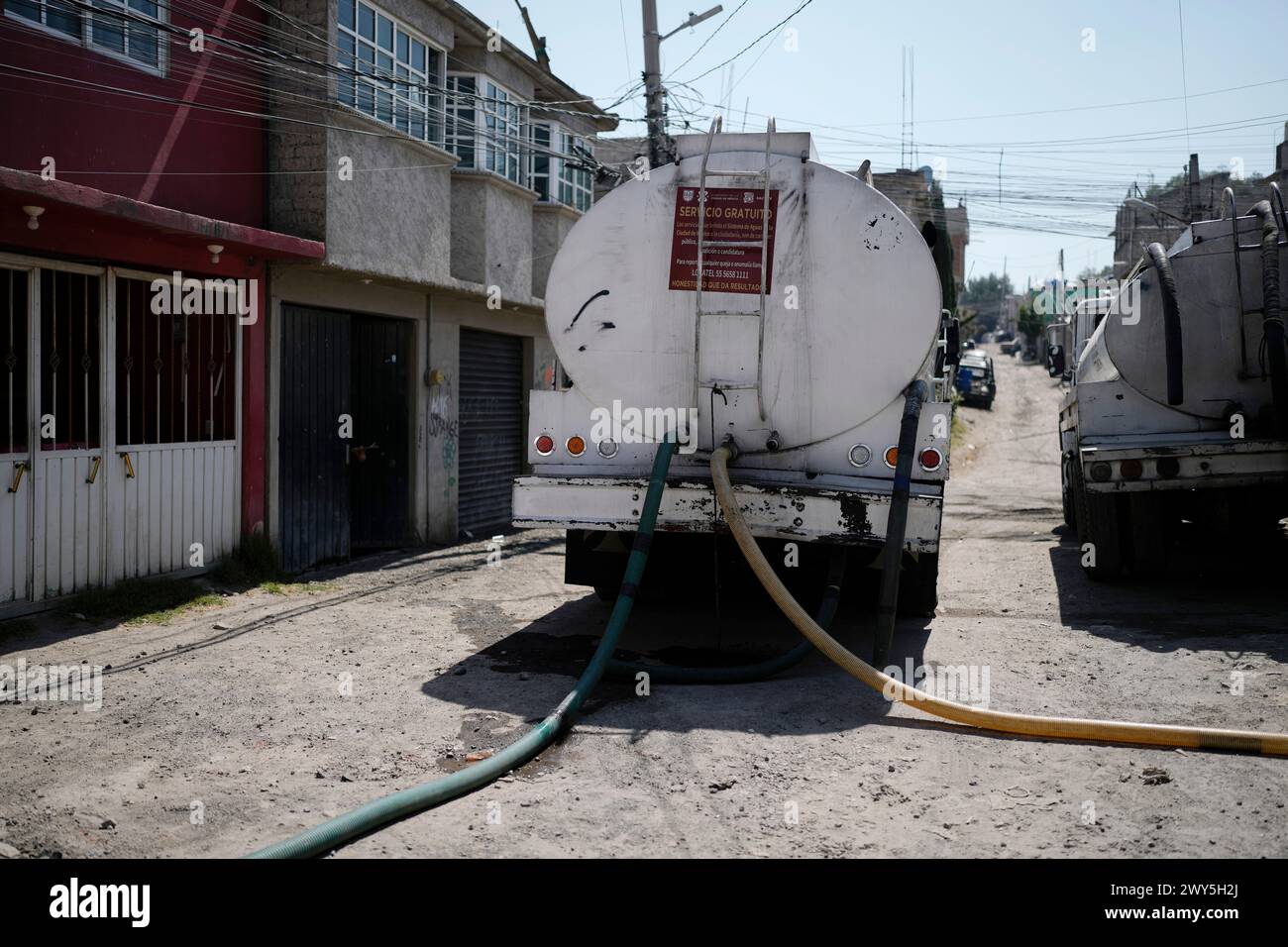 A water truck from the local government delivers free water in ...