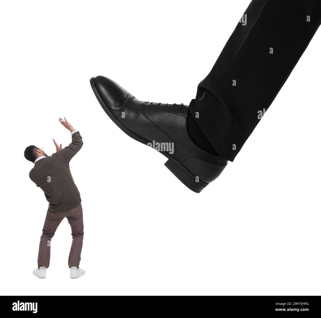 Giant stepping onto small man on white background Stock Photo - Alamy