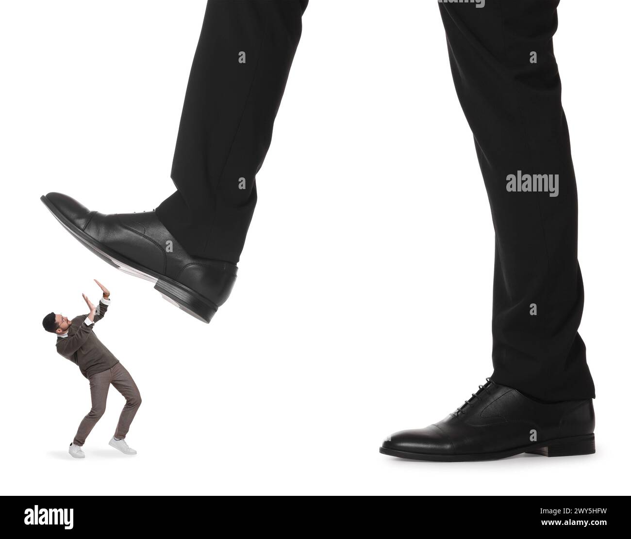 Giant stepping onto small man on white background Stock Photo - Alamy