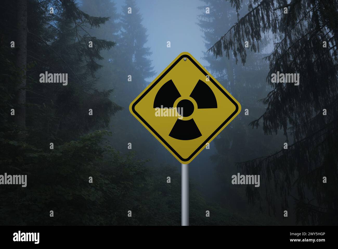 Radioactive pollution. Yellow warning sign with hazard symbol in forest ...