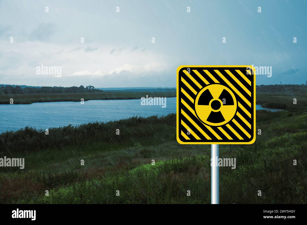 Radioactive pollution. Yellow warning sign with hazard symbol near ... Radioactive pollution. Yellow warning sign with hazard symbol near ...