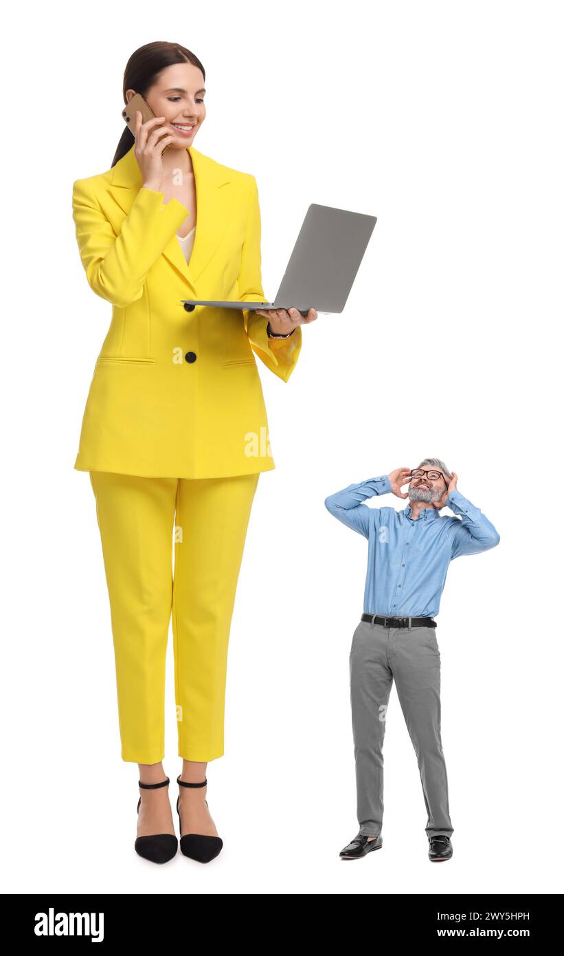 Small man shouting to giant woman on white background Stock Photo - Alamy